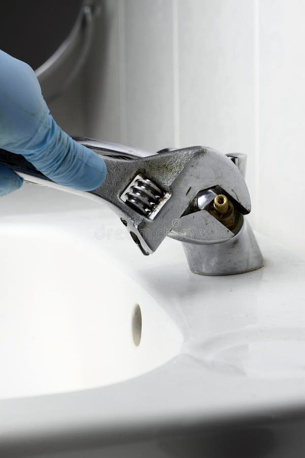 Tap fixing spanner stock photo. Image of tightening, hand - 64247642