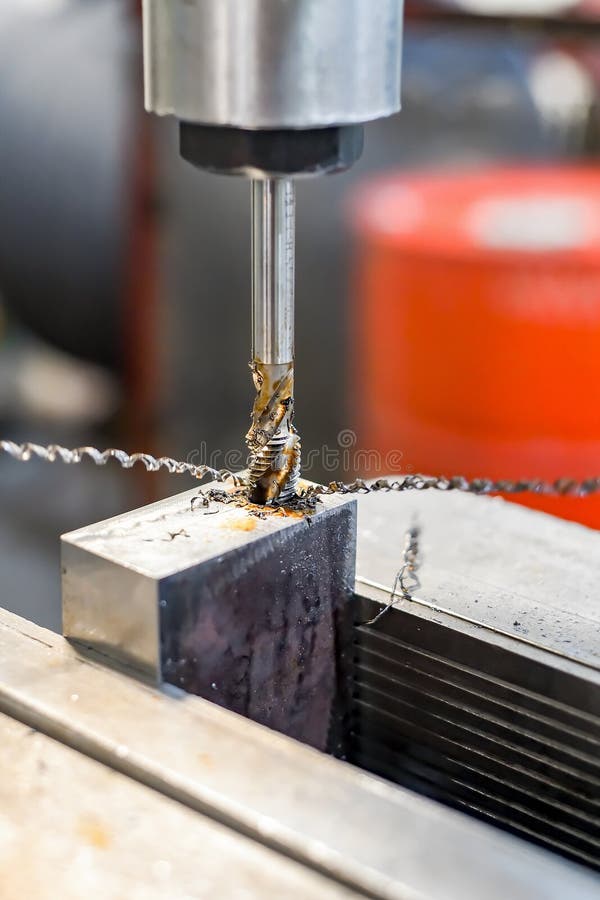 A Tap on a Machine for Tapping a Hole in a Part Stock Photo - Image of ...