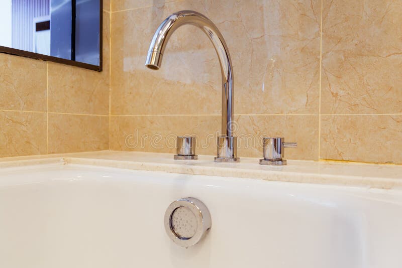 Tap and Overflow Button on Bathroom Stock Photo - Image of metal ...