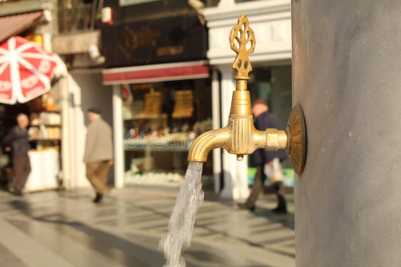 A Tap with Tiny Water Coming Out of it Stock Photo - Image of concept ...