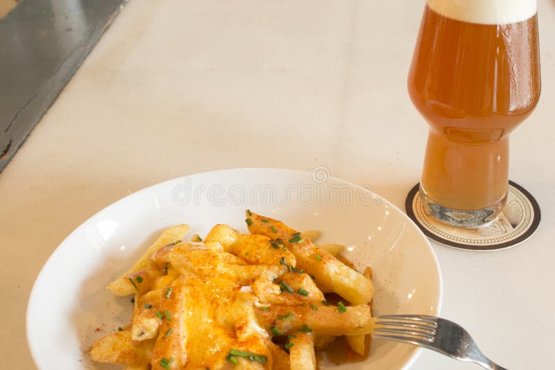 A Tapa of Chips with Cheese and Paprika when Ordering a Beer I Stock ...