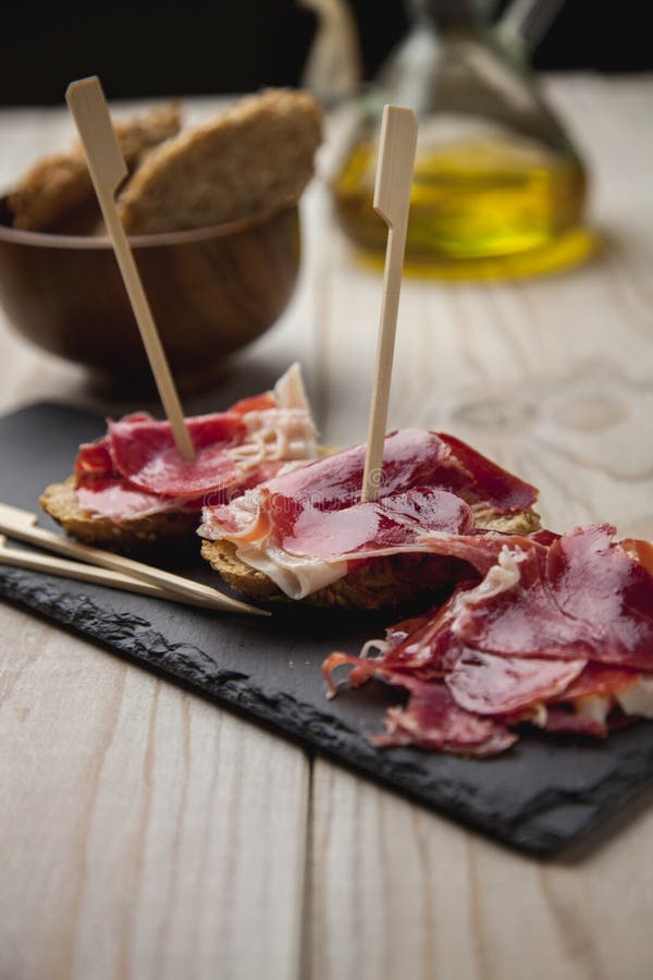 Appetizer Iberian Ham with Toasted Bread Stock Image - Image of iberian ...