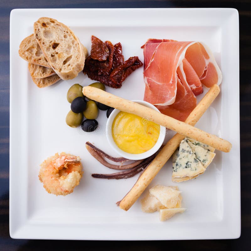 Tapas platter with ham stock photo. Image of antipasti - 103867752