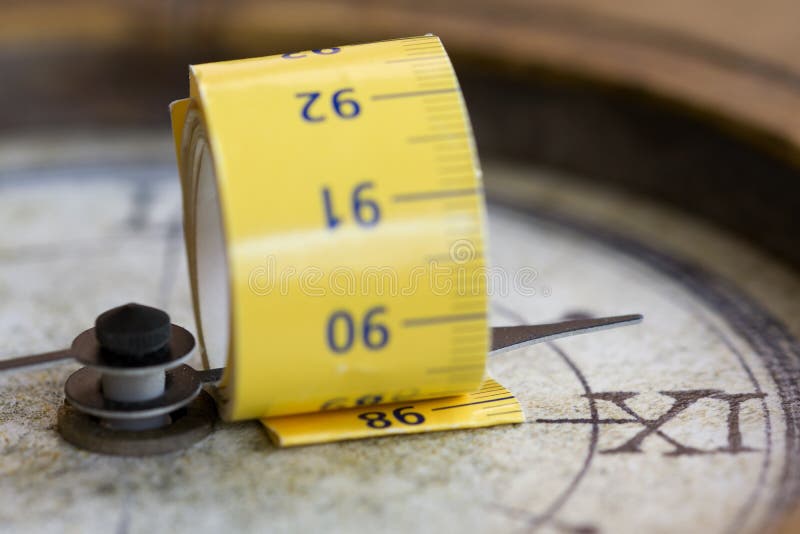 Tape-measure on the Face of an Old Clock. Time Measure Stock Photo ...