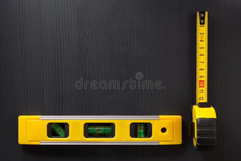 Tape Measure and Level on Wood Stock Photo - Image of concept, binder ...