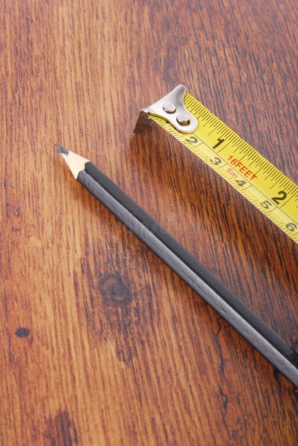 Tape measure and pencil stock image. Image of flooring - 34326423