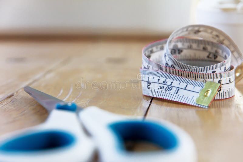 Tape measure and scissors stock image. Image of swirl - 23699101