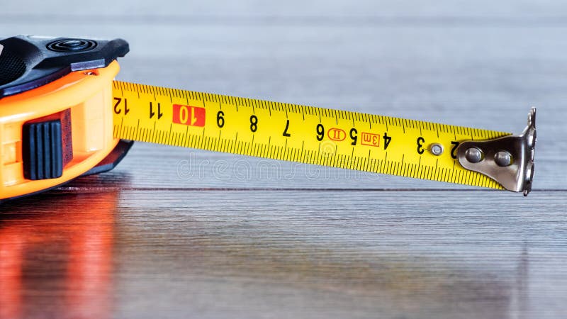 Tape Measure on a Wooden Dark Table, Measuring Tool Stock Image - Image ...