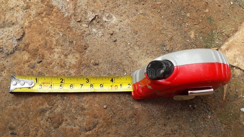 Tape Measurer or Meteran on Ground Stock Image - Image of vehicle ...