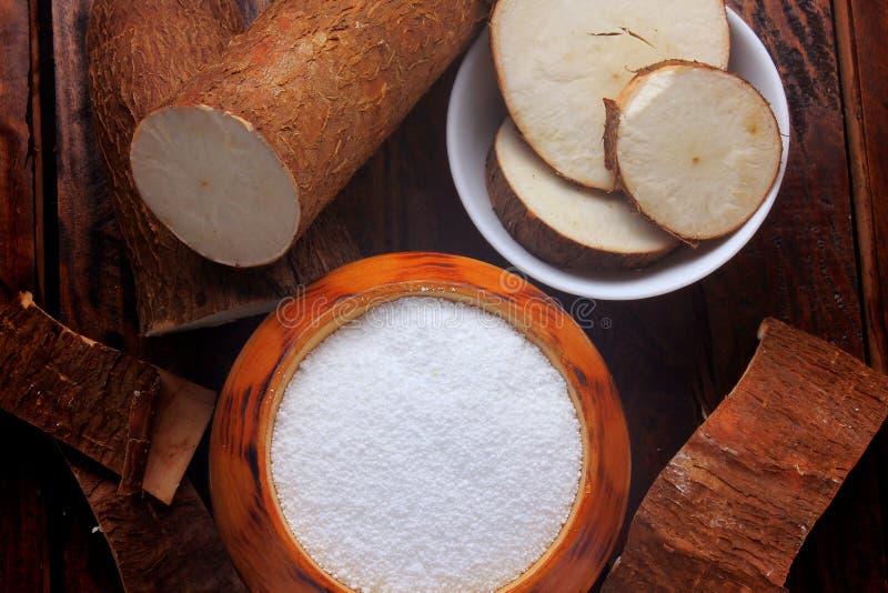 Tapioca Flour in Wooden Bowl on Rustic Wooden Table, Next To Cut and ...
