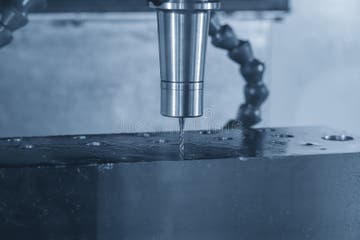 The Tapping Process on CNC Milling Machine in the Light Blue Scene ...