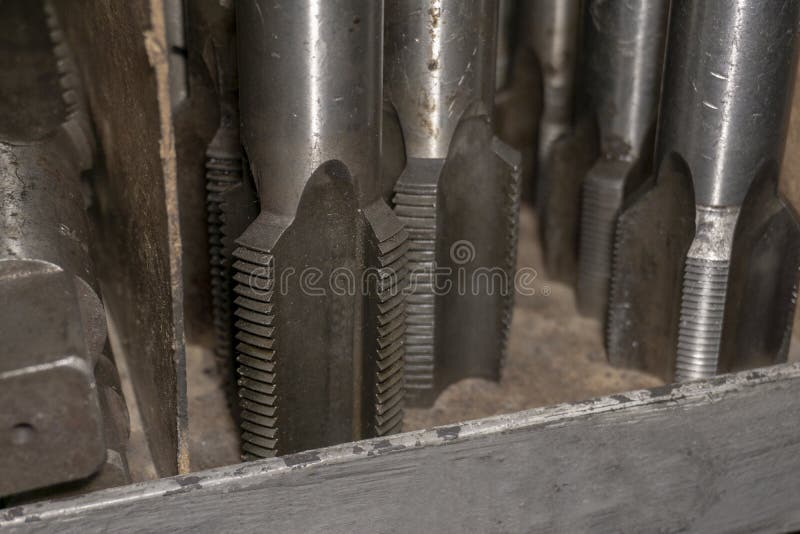 A Tapping Tap Lies in a Workshop in a Warehouse Stock Image - Image of ...