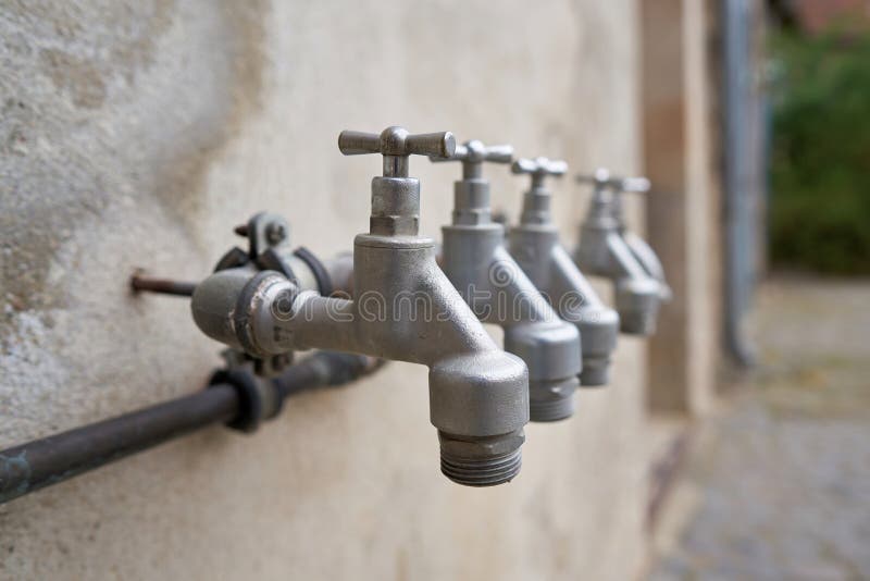 Taps on the Facade of a House Stock Photo - Image of drought, gardening ...