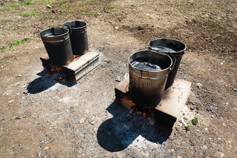 Tar or pitch buckets stock image. Image of melted, heating - 34029645