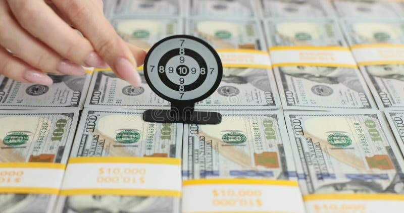 Target Game is Played on a Stack of Hundred Dollar Bills Stock Video ...