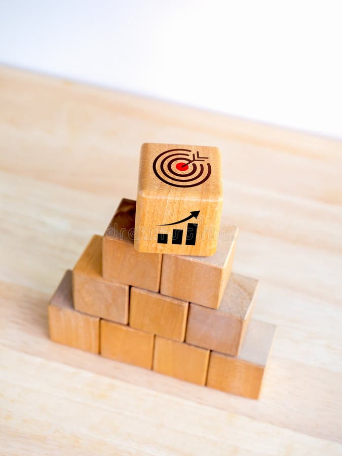Target Icon and Growth Graph Symbol on Top of Wooden Cube Blocks Stack ...