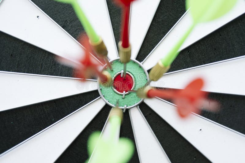 Target with Red and Green Darts Stuck in the Center Stock Photo - Image ... Target with Red and Green Darts Stuck in the Center Stock Photo - Image ...