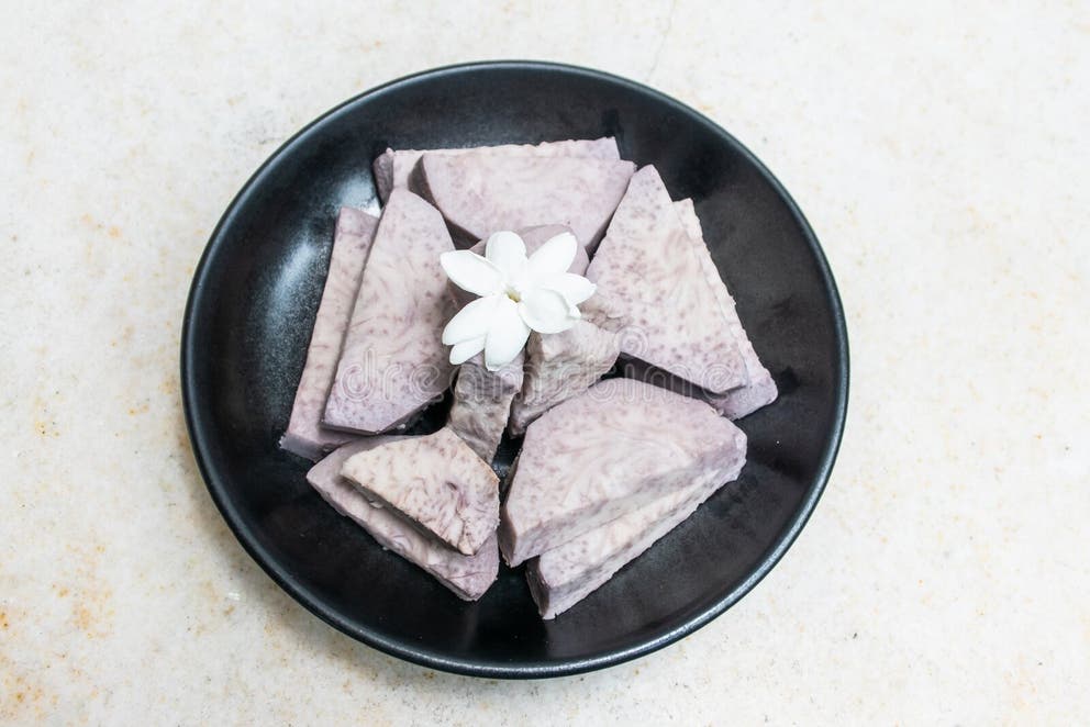 Taro in Black Plate on Marble Table Stock Image - Image of isolated ...