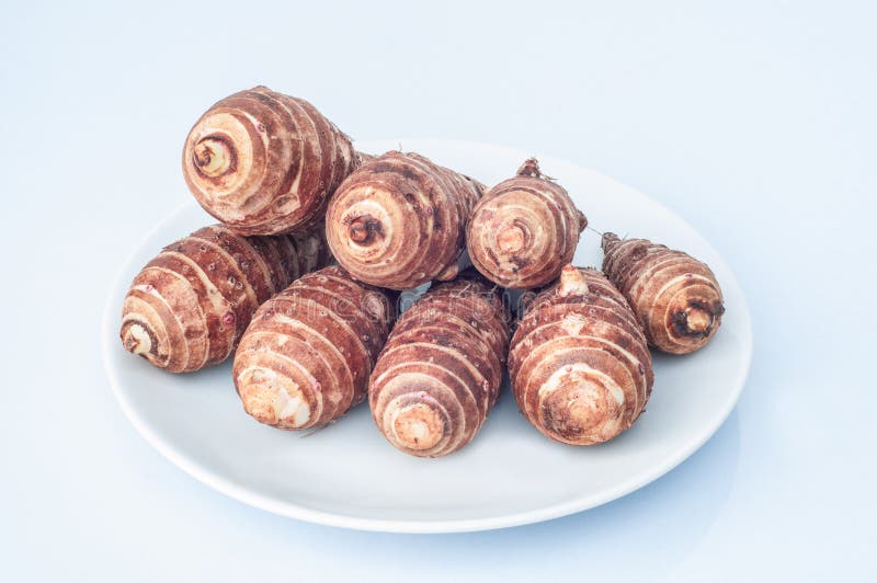 Taro on white plate stock image. Image of potato, starch - 27656837