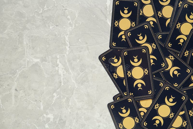Tarot Cards on Grey Table, Top View and Space for Text. Reverse Side ...