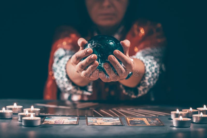 Tarot Reader with Tarot Cards.Tarot Cards Face Down on Table Near ...