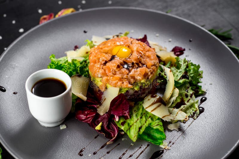 A Tartar Dish on Black Wooden Baclground Stock Image - Image of meat ...