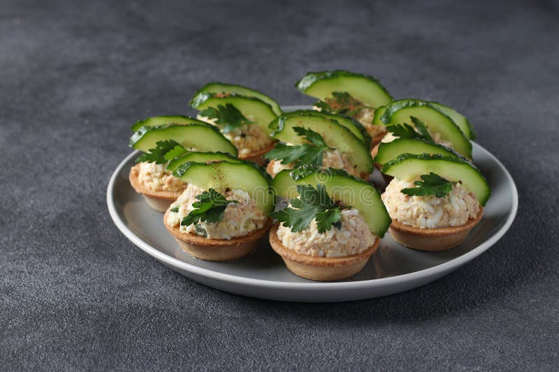 Tartlets with Cod Liver, Egg, Garnished with Cucumber and Parsley on ...