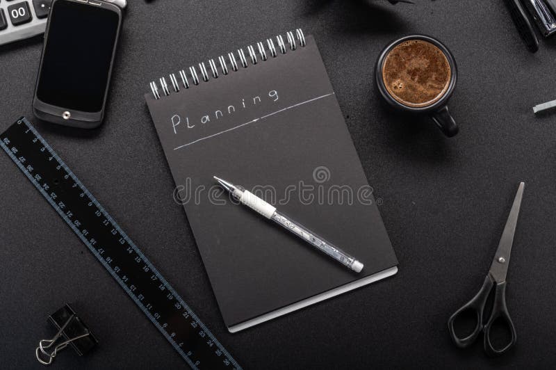 Tasks and Planning. Future Plans. Black Notebook and White Pen ...
