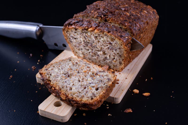 Tasting Bread with Seeds on a Wooden Board. Fresh Dark Bread on the ...