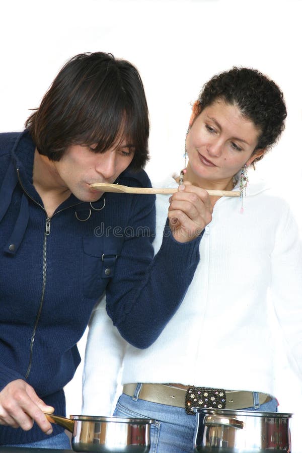 Tasting the cooking stock image. Image of couple, bite - 318493