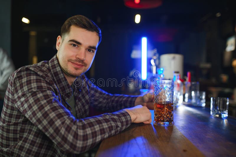 Tasting a Good Beer. Portrait of Thoughtful Men Drinking Beer at the ... Tasting a Good Beer. Portrait of Thoughtful Men Drinking Beer at the ...