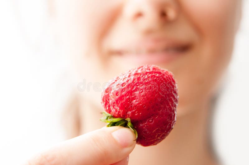 Tasting a strawberry stock photo. Image of exterior, round - 54752582