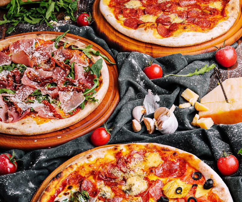 Tasty Assorted Three Pizzas on a Wooden Boards Stock Image - Image of ...