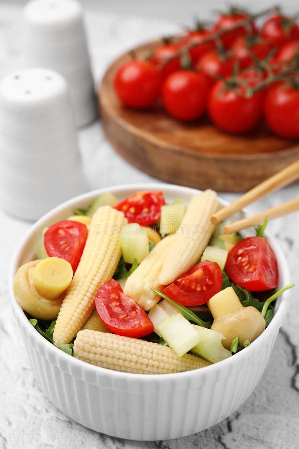 Tasty Baby Corn with Vegetables and Champignons on Grey Textured Table ...