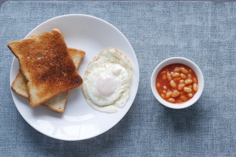 Tasty Baked Beans, Egg and Bread for Morning Break Fast Stock Photo ...