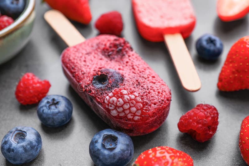 Tasty Berry Ice Pops on Dark Table, Closeup. Fruit Popsicle Stock Photo ...