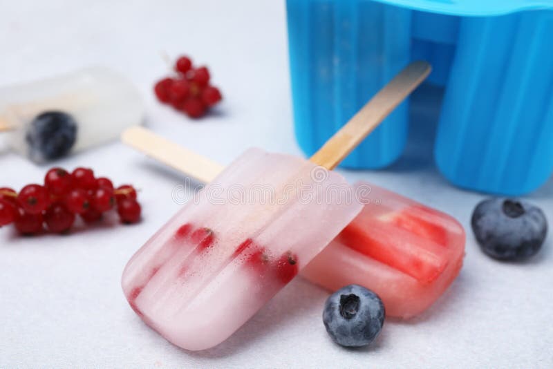 Tasty Berry Ice Pops on Light Table, Closeup Stock Image - Image of ...