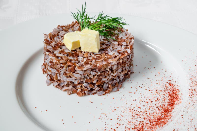 Tasty Breakfast. Pyramid of Buckwheat with Butter and Herbs. Horizontal ...