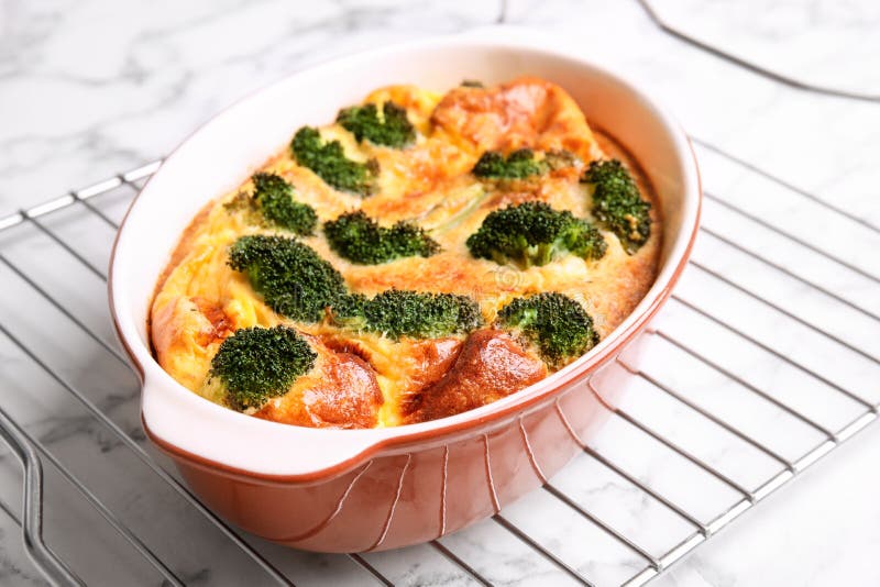 Tasty Broccoli Casserole in Baking Dish on Cooling Rack Stock Image ...