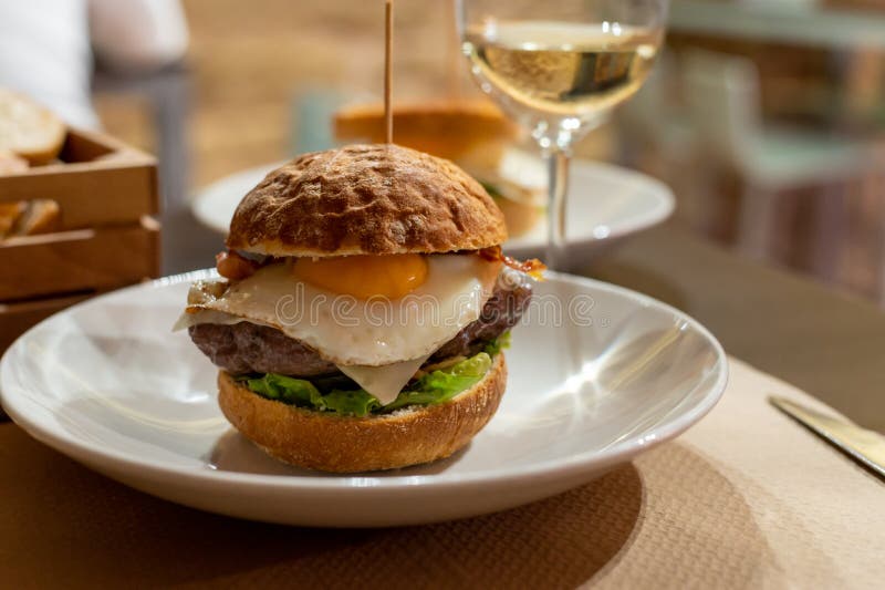 Tasty Burger with White Crispy Ban, Beef Burger, Egg, Green Lettuce and ...