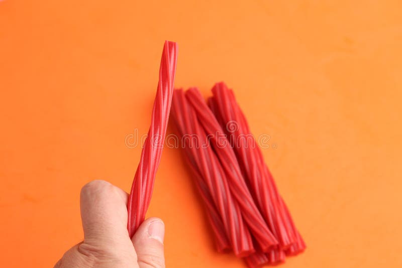 Tasty Candy Sticks on an Orange Background Stock Image - Image of sweet ...