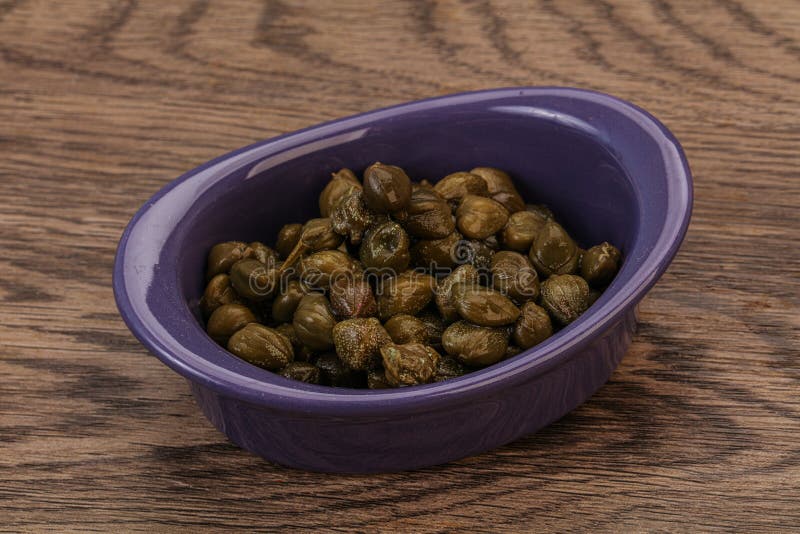 Tasty capers in the bowl stock photo. Image of appetizer - 187799828