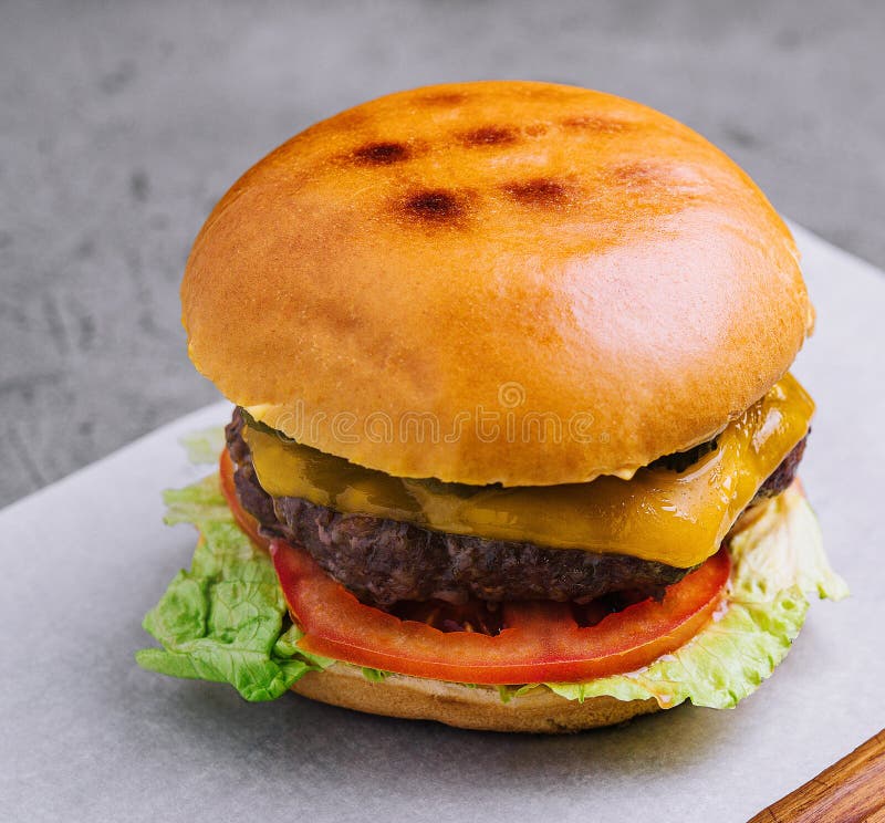 Tasty Cheeseburger with Lettuce, Cheese and Tomato Stock Image - Image ...