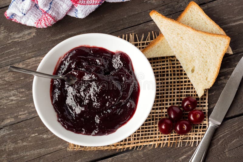 Tasty cherry jam in bowl stock image. Image of close - 90680609