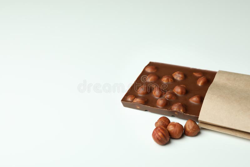 Tasty Chocolate Bar in Paper on White Background Stock Photo - Image of ...