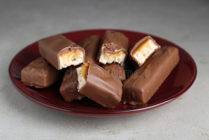 Tasty Chocolate Bars with Caramel on Light Grey Textured Table Stock ...
