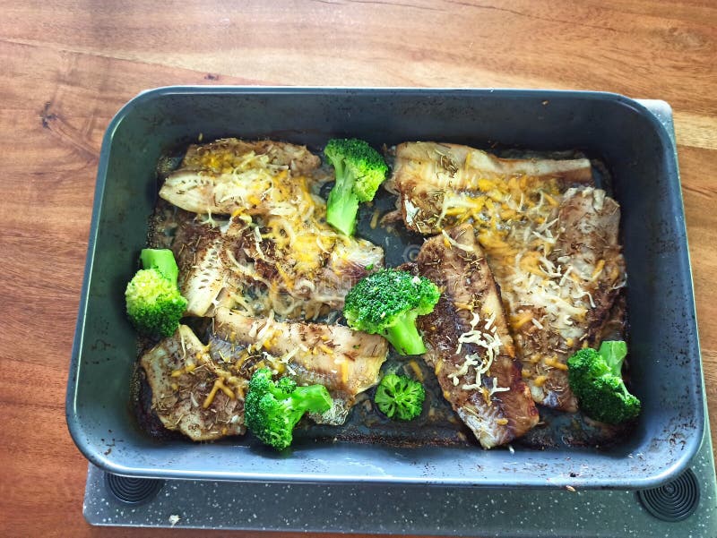 Tasty Cod Cooked with Vegetables Served on Wooden Table Stock Photo ...