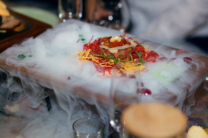 Tasty Cold Dish with Vegetables and Fish, Served with Liquid Nitrogen ...