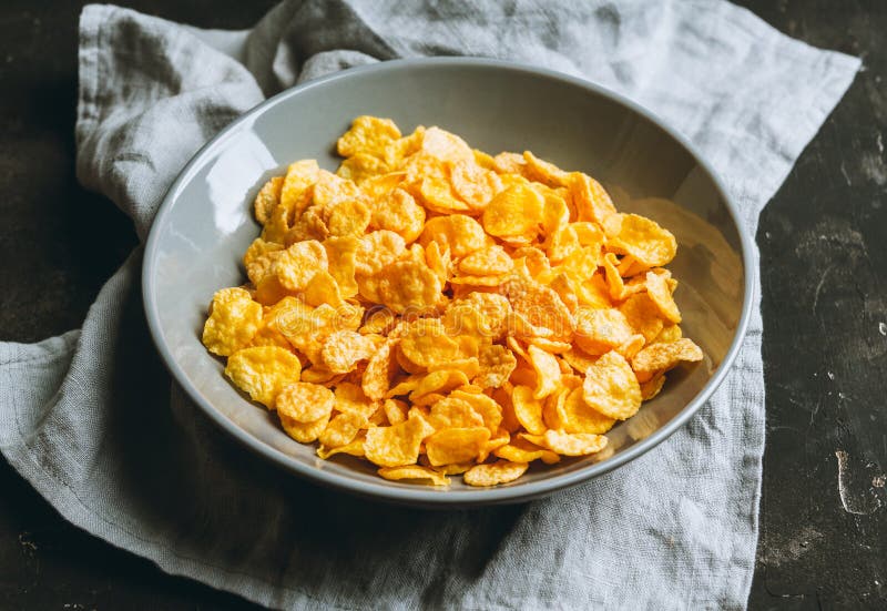Tasty Crispy Corn Flakes in Bowl on the Rustic Background Stock Image ...