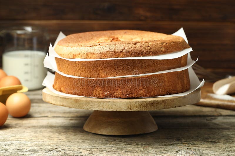 Tasty Cut Sponge Cake and Ingredients on Wooden Table Stock Photo ...